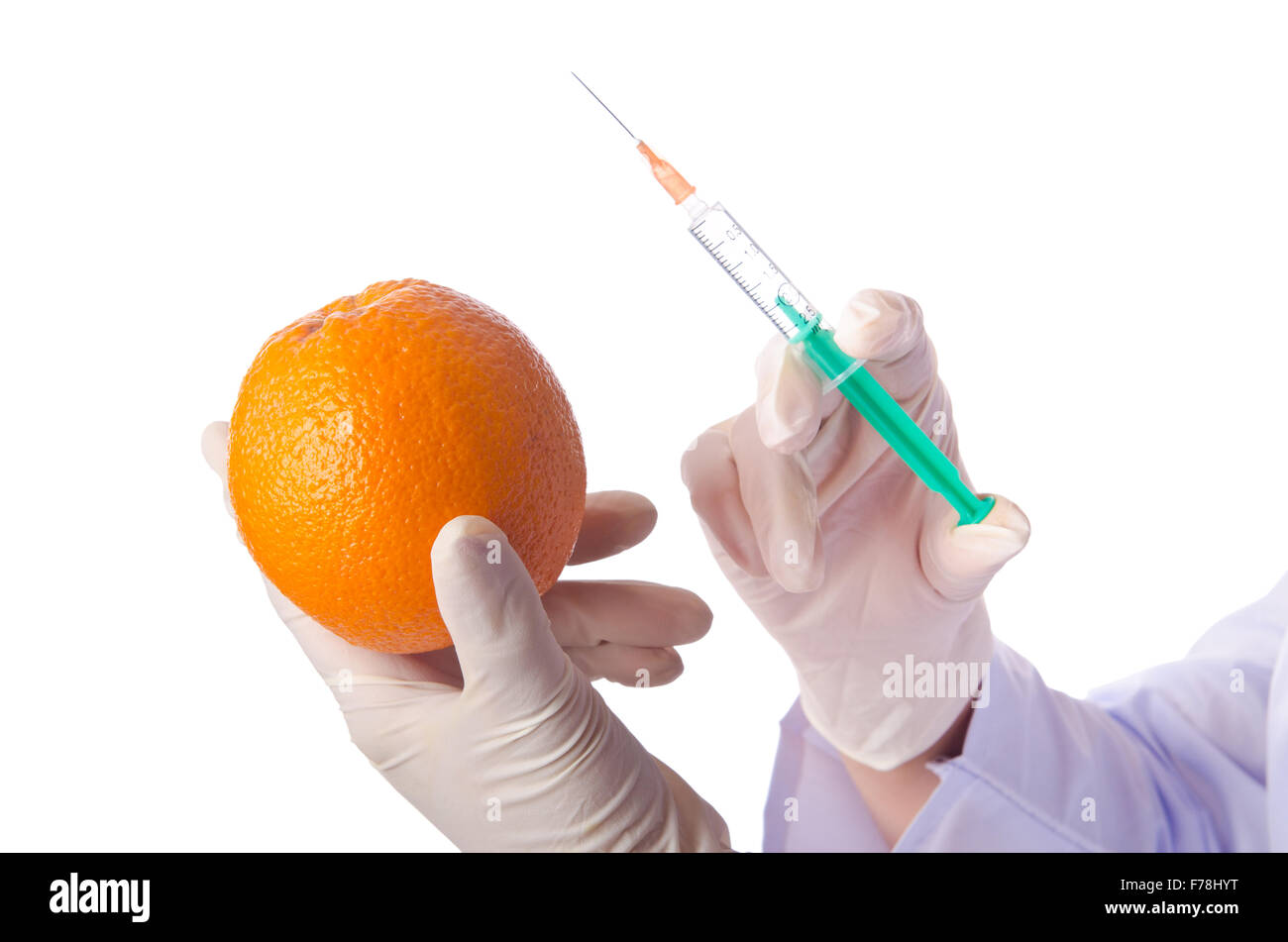 Science experiment with orange and syringe Stock Photo - Alamy