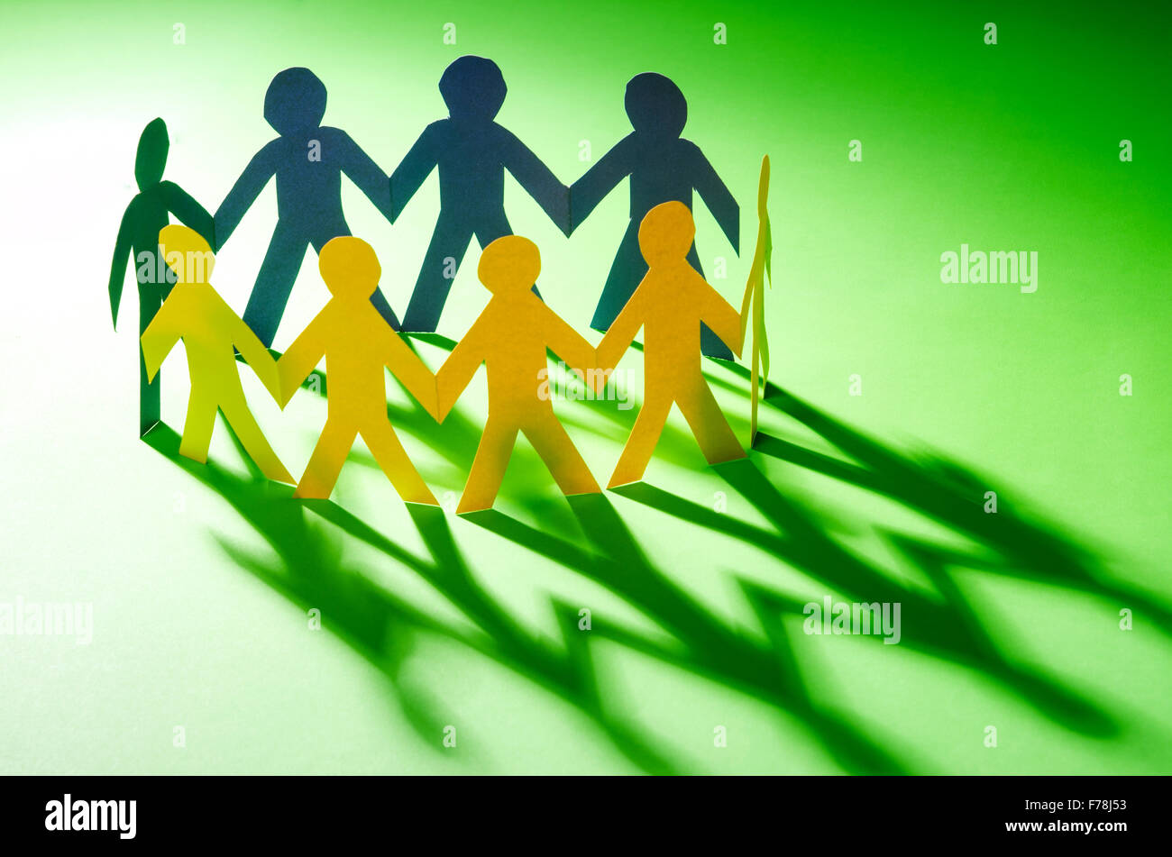Paper people in teamworking concept Stock Photo - Alamy