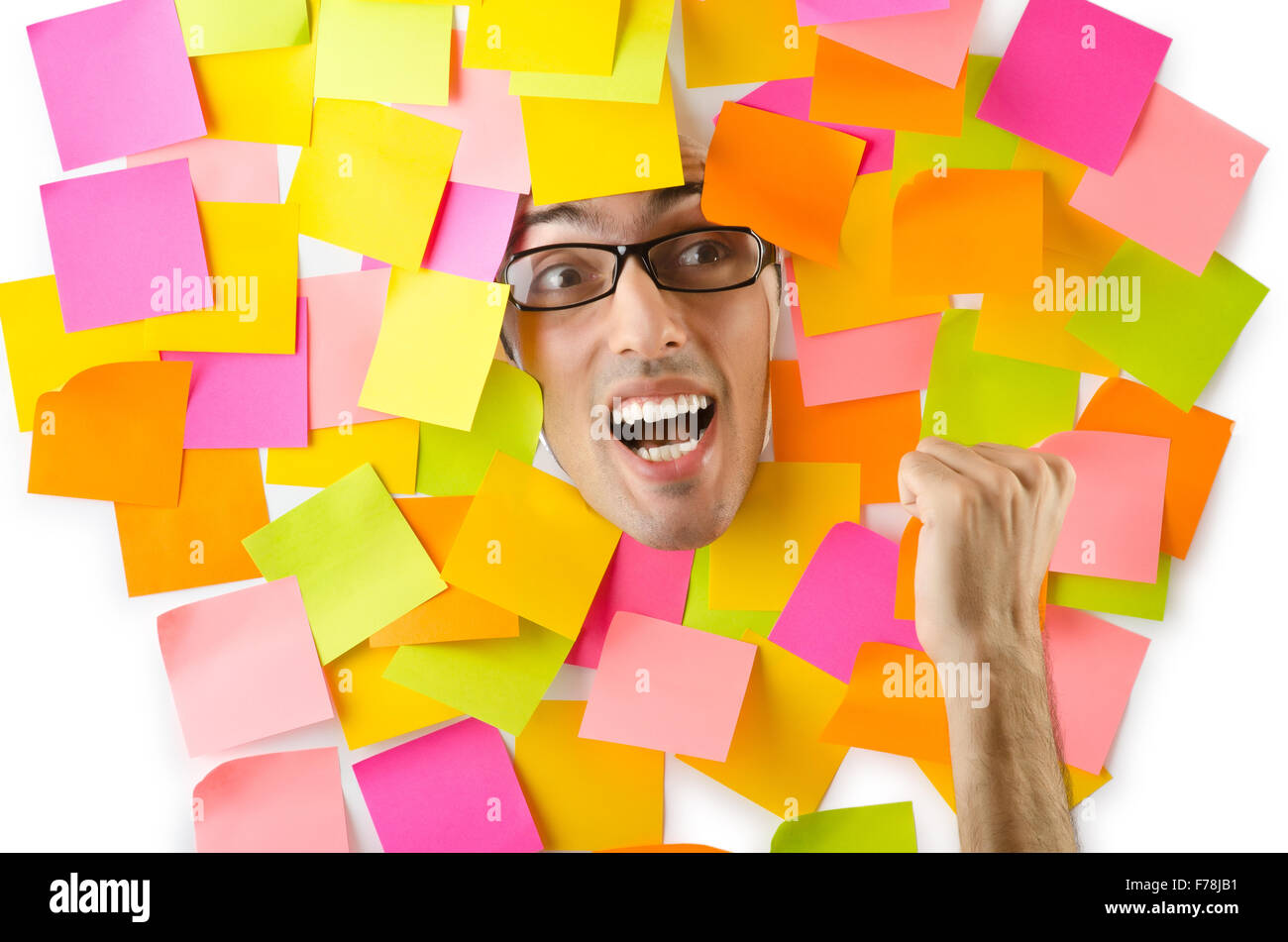 Man's face through paper and reminders Stock Photo - Alamy