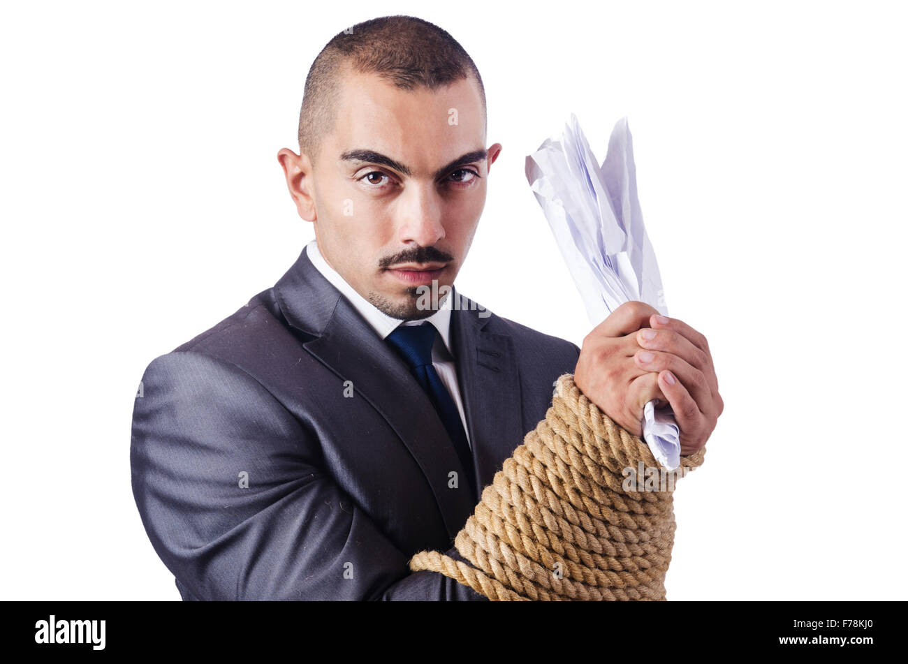 Businessman tied up with rope Stock Photo - Alamy