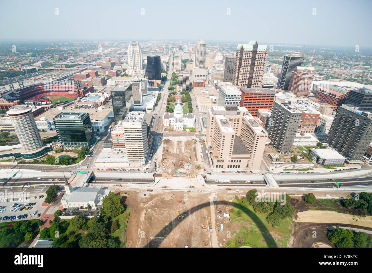St Louis Gateway Arch shadow over construction site below with the city ...