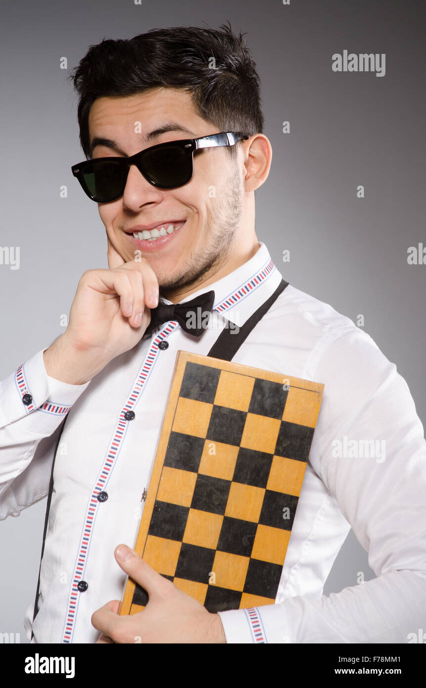 Funny chess player with board Stock Photo - Alamy