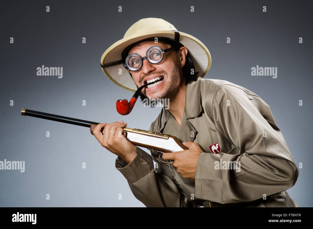 Hunter with rifle and smoking pipe Stock Photo - Alamy