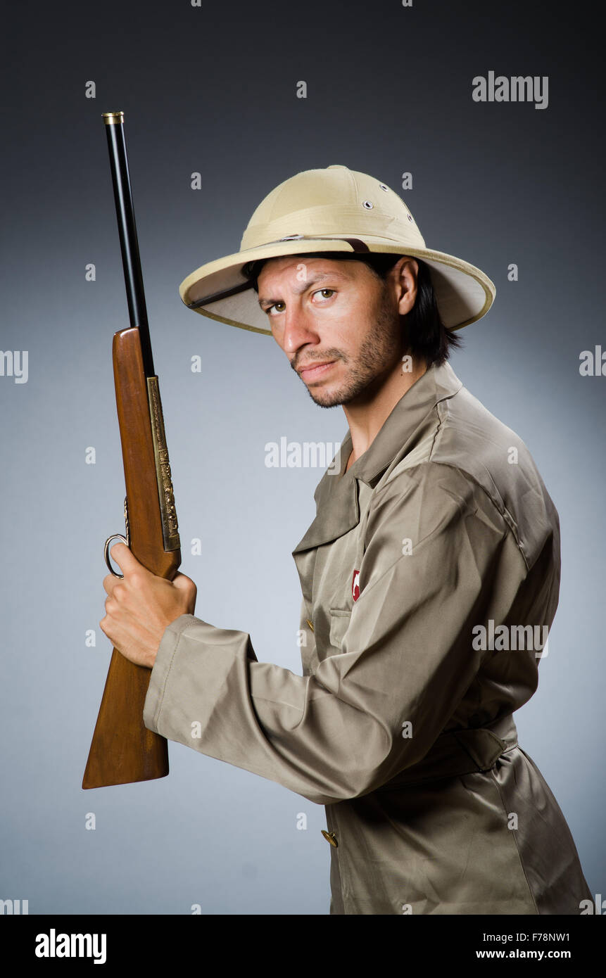 Funny safari hunter with rifle Stock Photo - Alamy