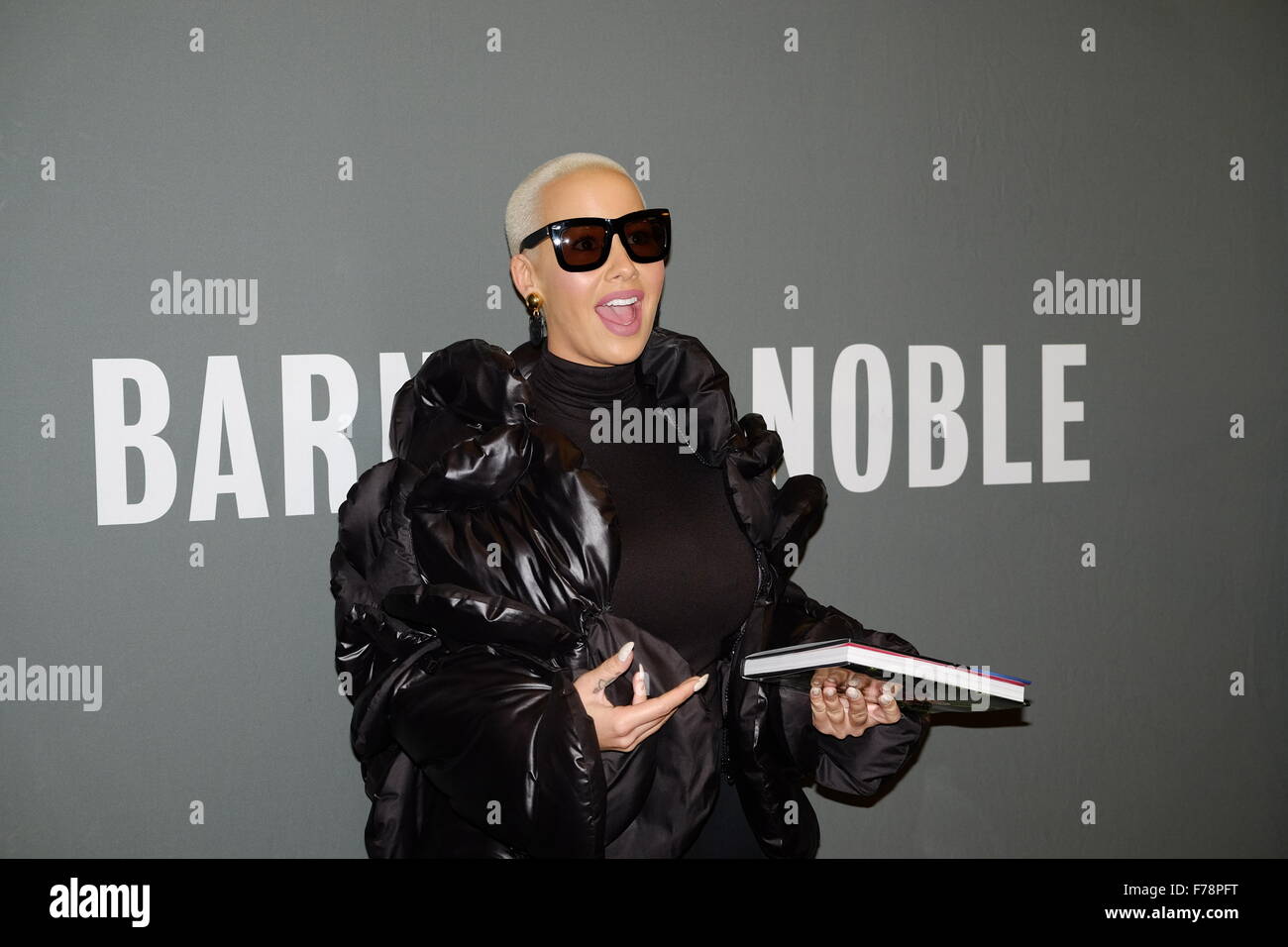 Music artist Amber Rose signs copies of her book 'How To Be A Bad Bitch ...