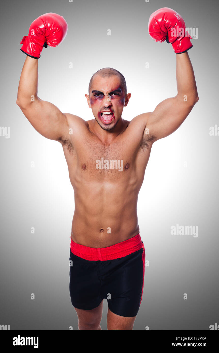 Badly beaten boxer isolated on white Stock Photo - Alamy