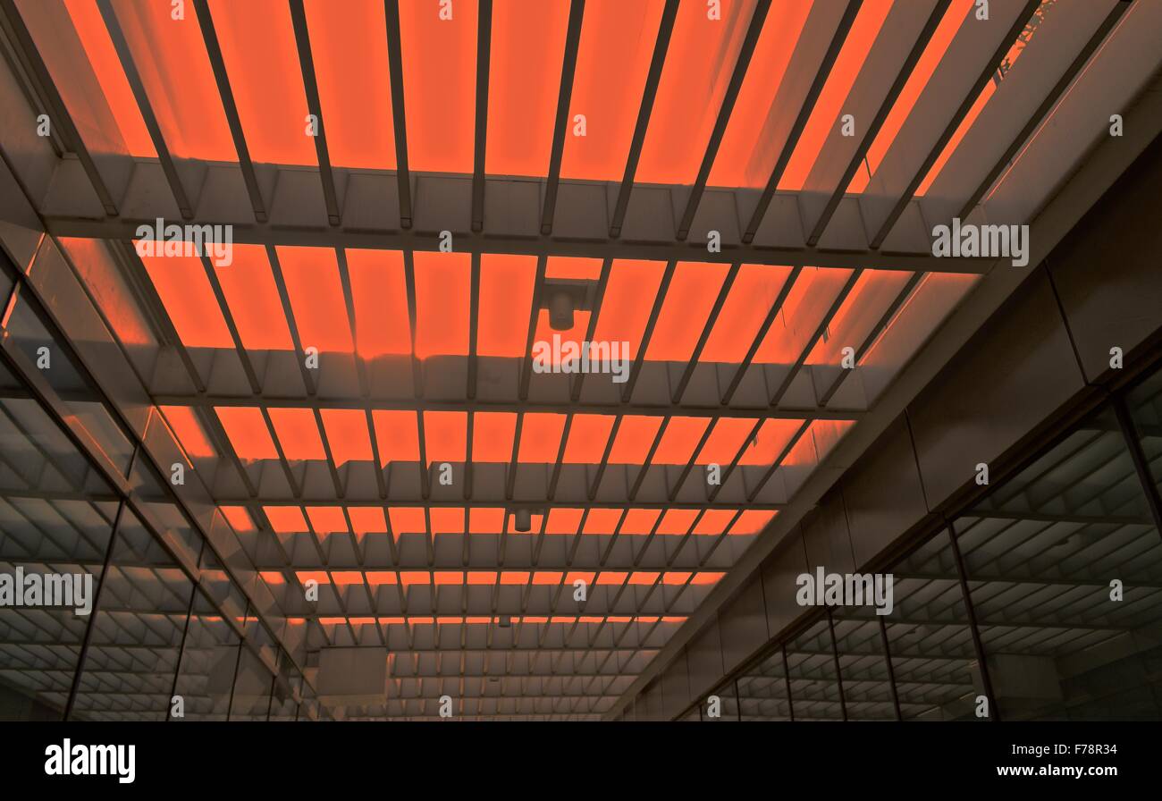 A modern open roof with red light and strip pattern in building Stock ...