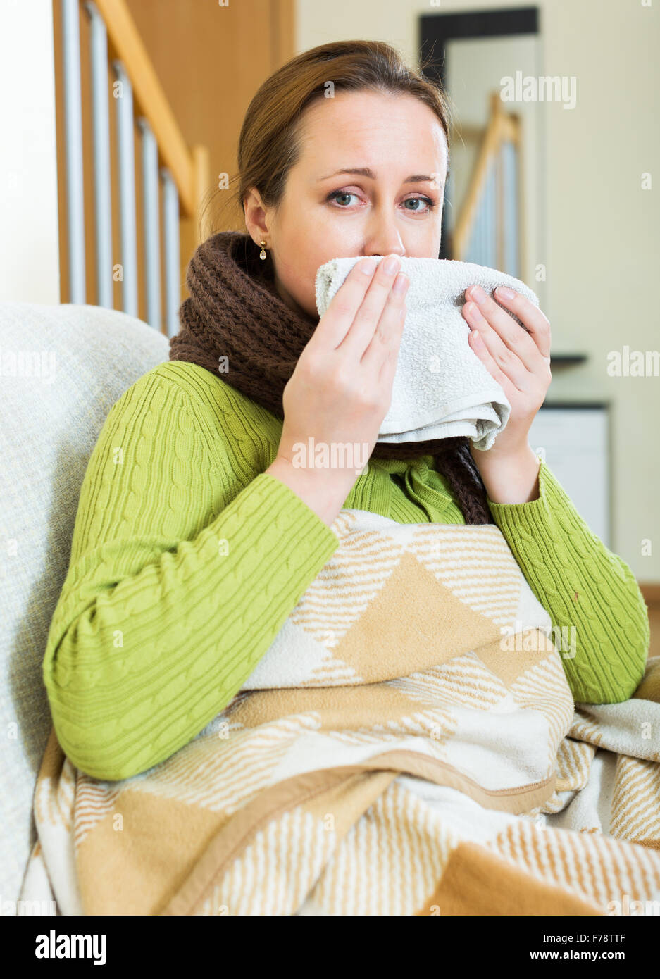 Sick lonely woman on sofa at home Stock Photo - Alamy