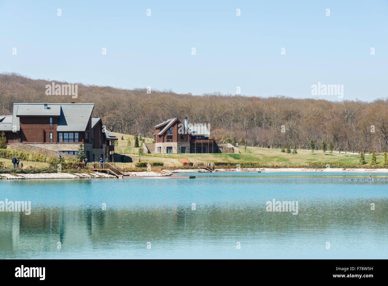 Modern house near water on bright day Stock Photo - Alamy