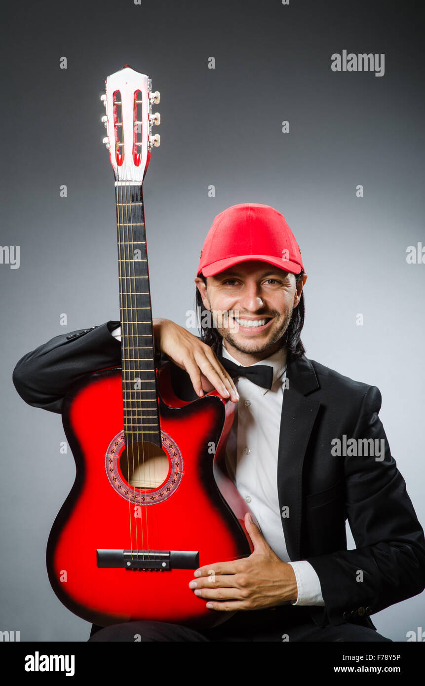 Funny guitar player in studio Stock Photo - Alamy