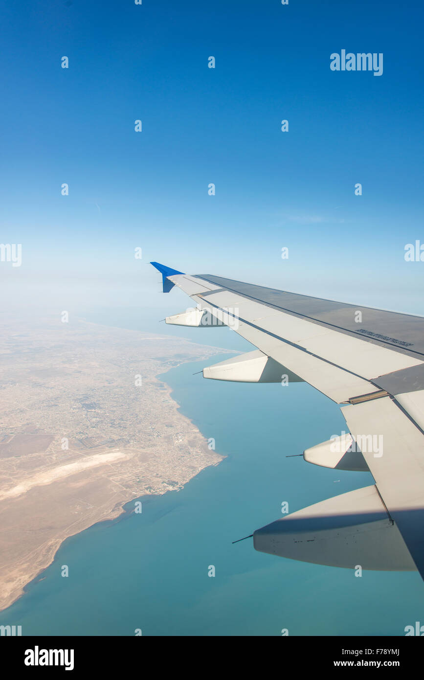 Airplane wing out of window Stock Photo - Alamy