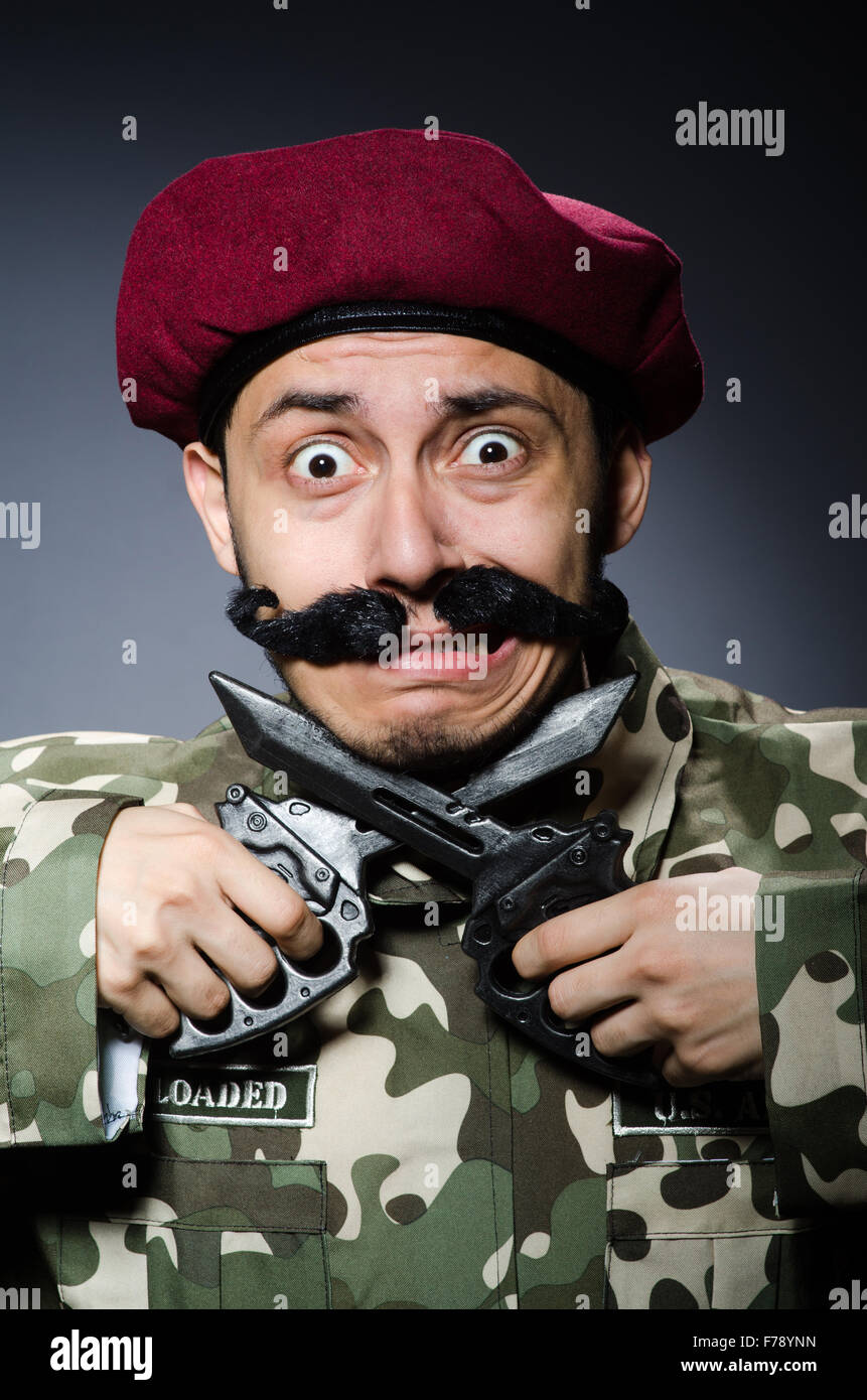Funny soldier against the dark background Stock Photo - Alamy