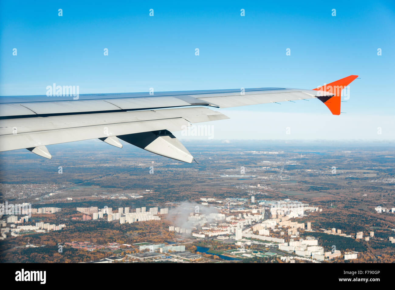 Airplane wing out of window Stock Photo - Alamy