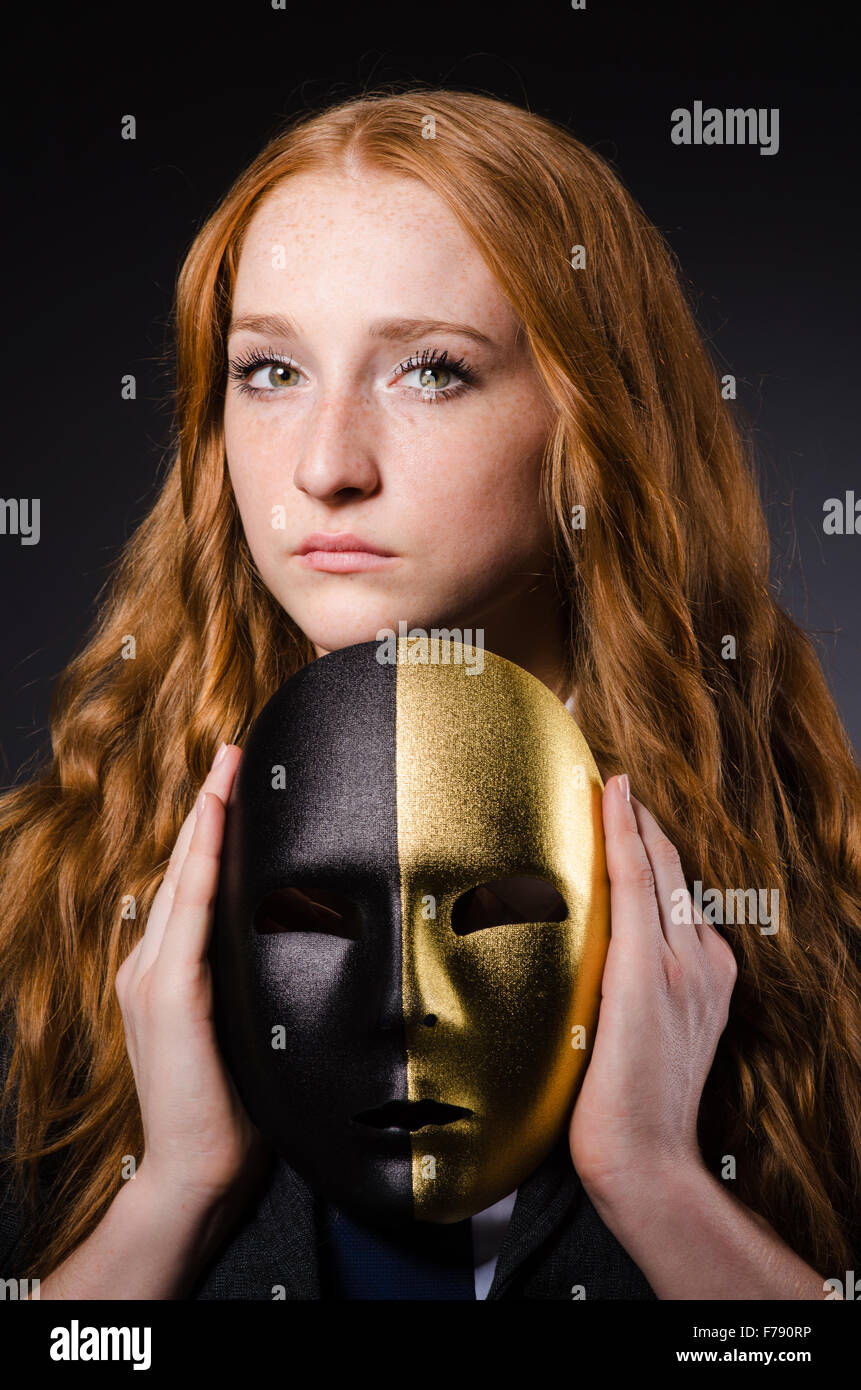 Woman with mask in hypocrisy concept Stock Photo - Alamy