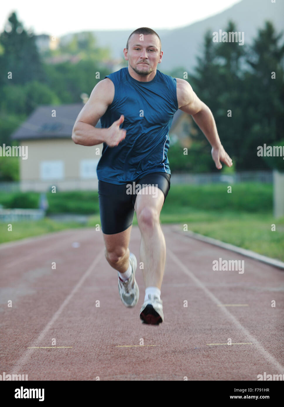 young healthy man run on athletic race sport track and representing ...