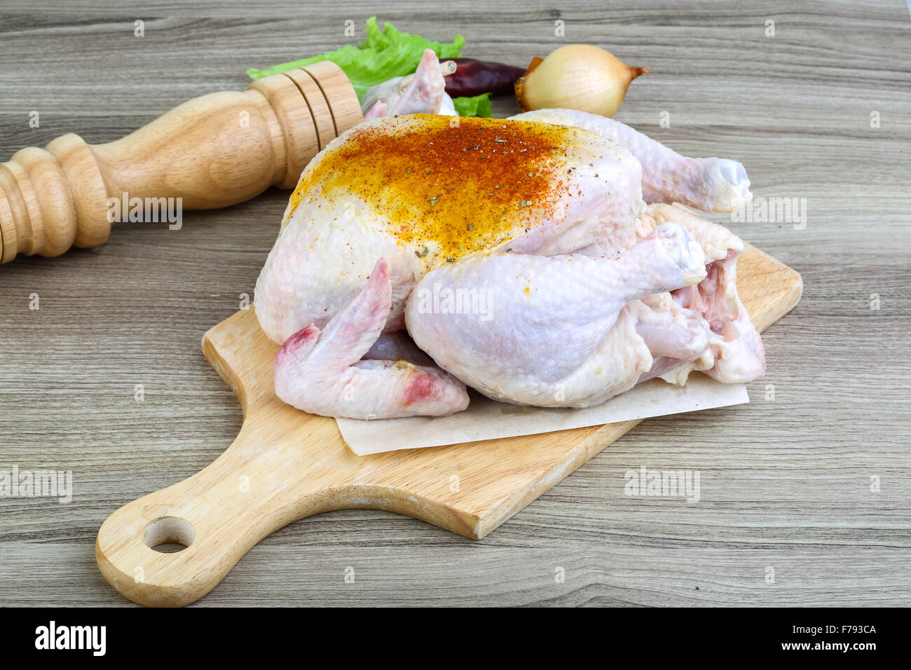 Raw chicken with spices ready for cooking Stock Photo - Alamy
