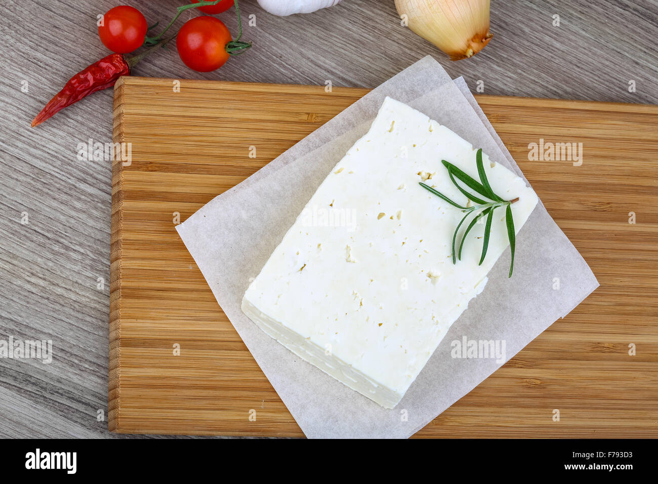 Traditional Caucasian homemade Cheese Brinza with rosemary on wood ...