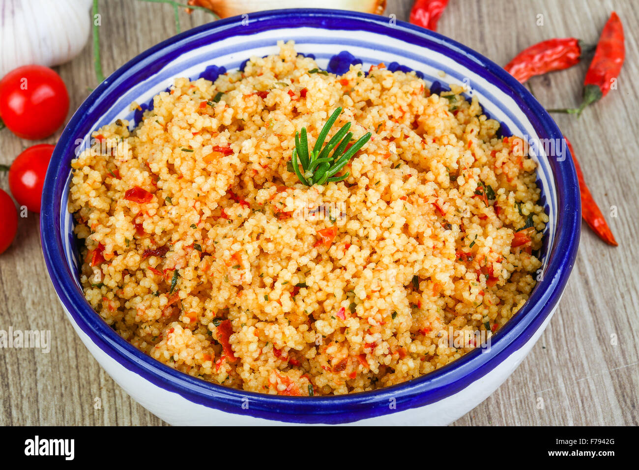 Arabic traditional cuisine - Couscous with tomato and green onion Stock ...