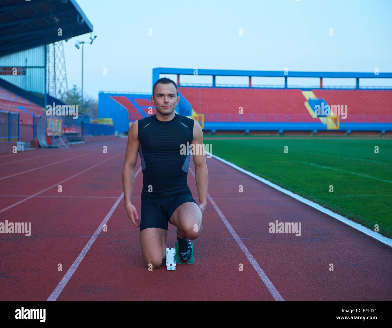 Sprinter leaving starting blocks on the running track. Explosive start ...