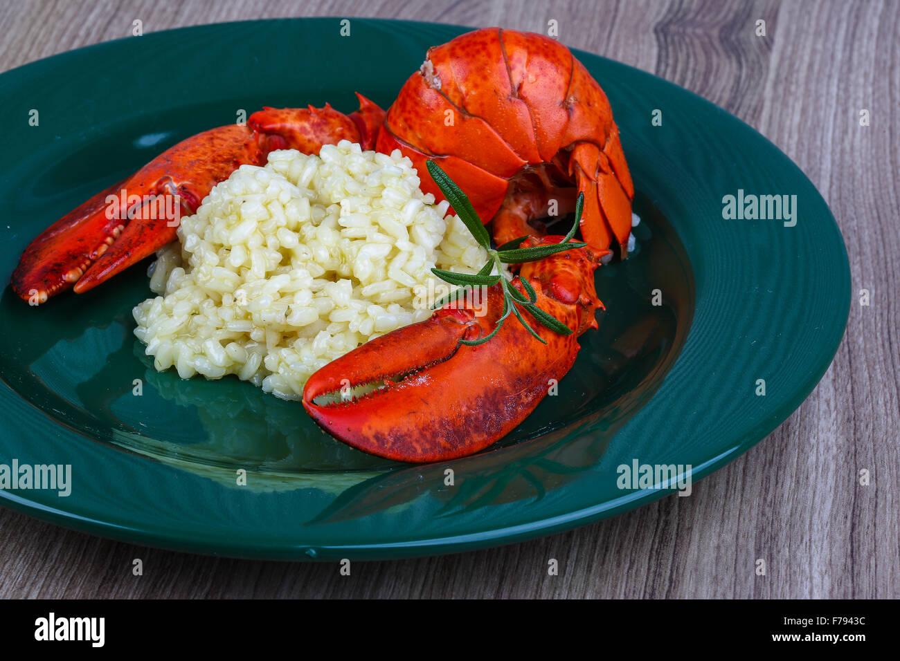 Delicous Risotto with lobster served rosemary and parmesan Stock Photo ...