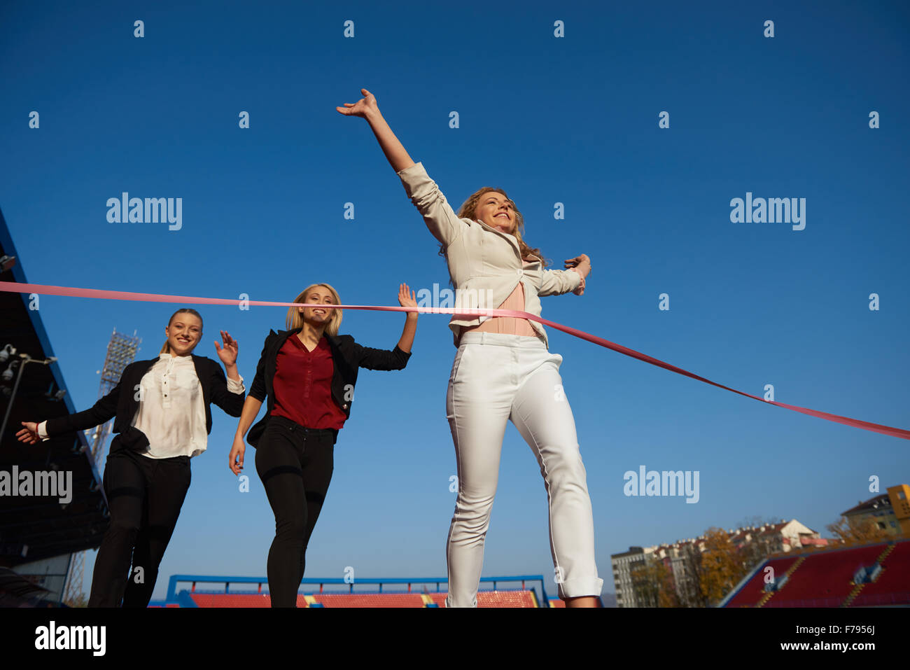 business people running together on racing track Stock Photo - Alamy