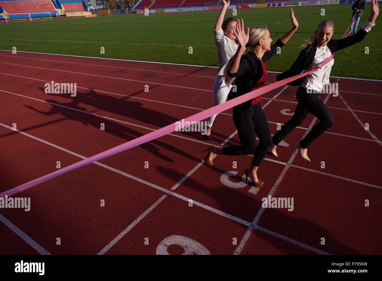 business people running together on athletics racing track Stock Photo ...