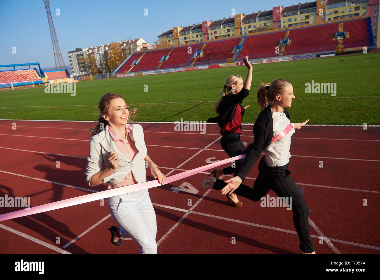 business people running together on racing track Stock Photo - Alamy