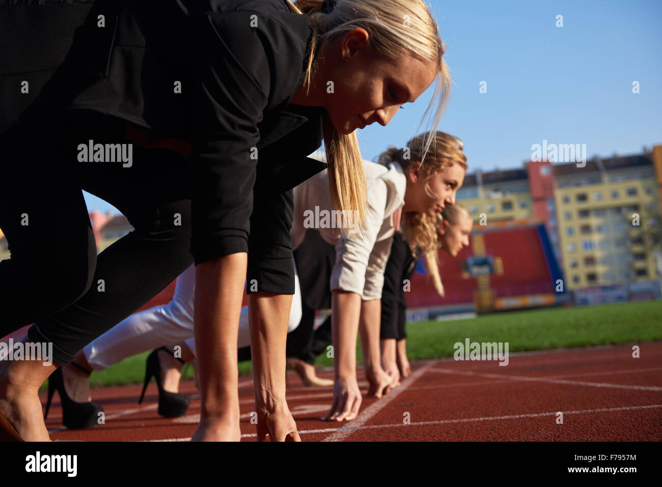business people running together on racing track Stock Photo - Alamy