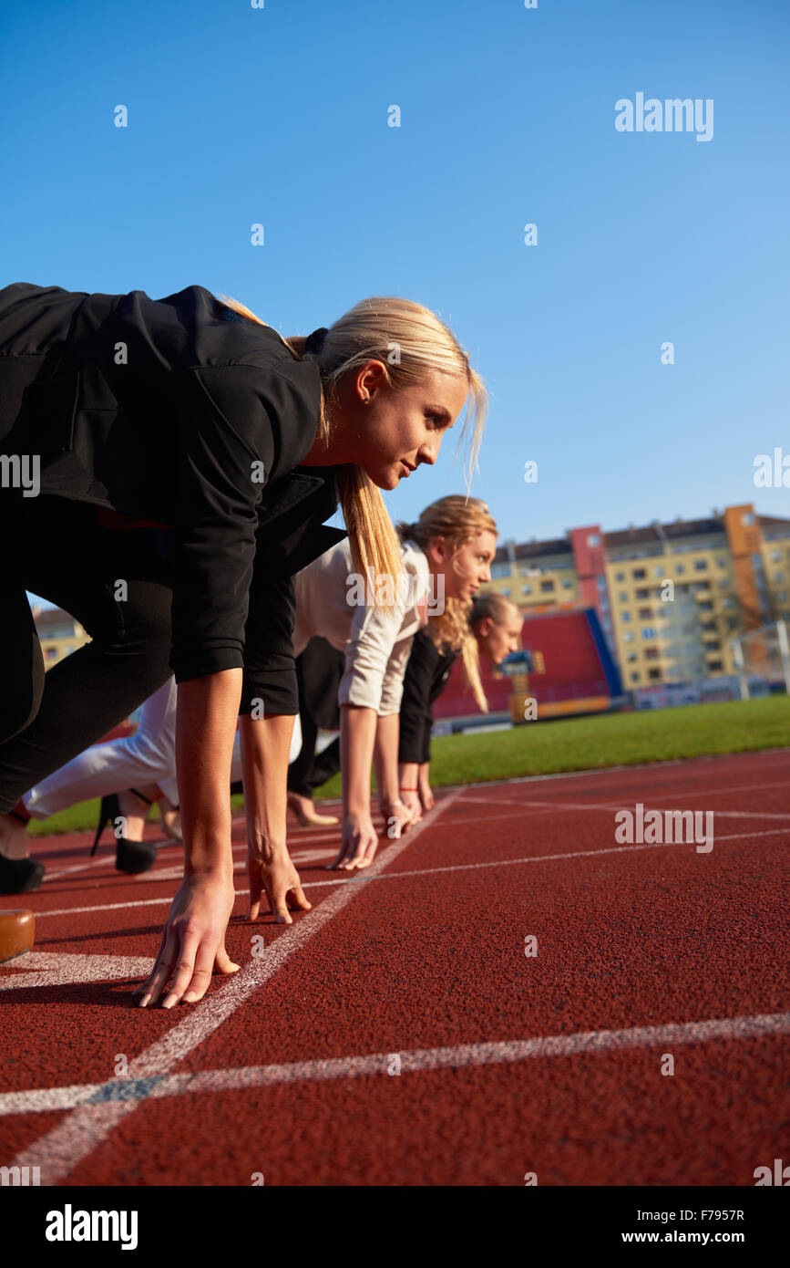 business people running together on racing track Stock Photo - Alamy