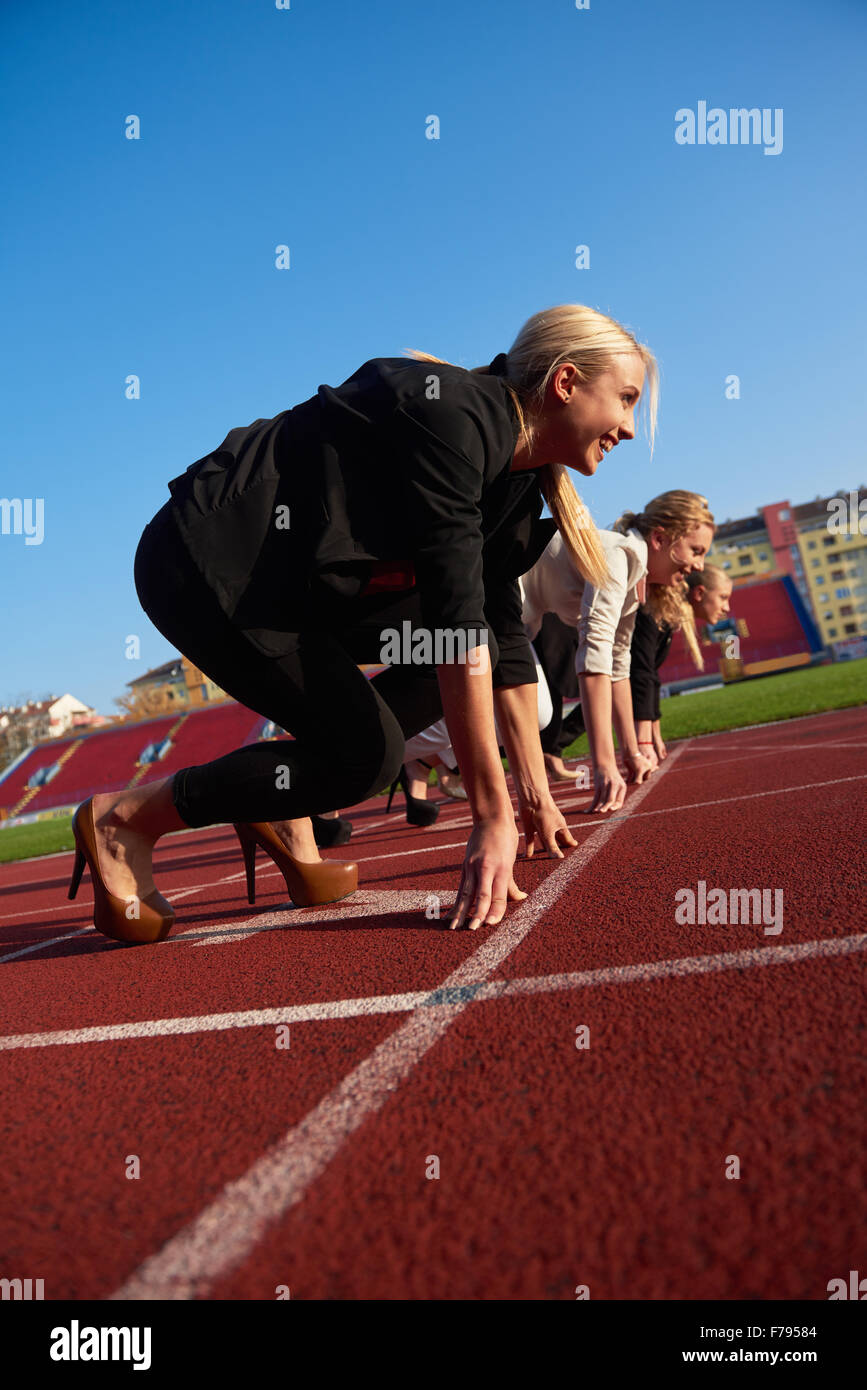 business people running together on racing track Stock Photo - Alamy