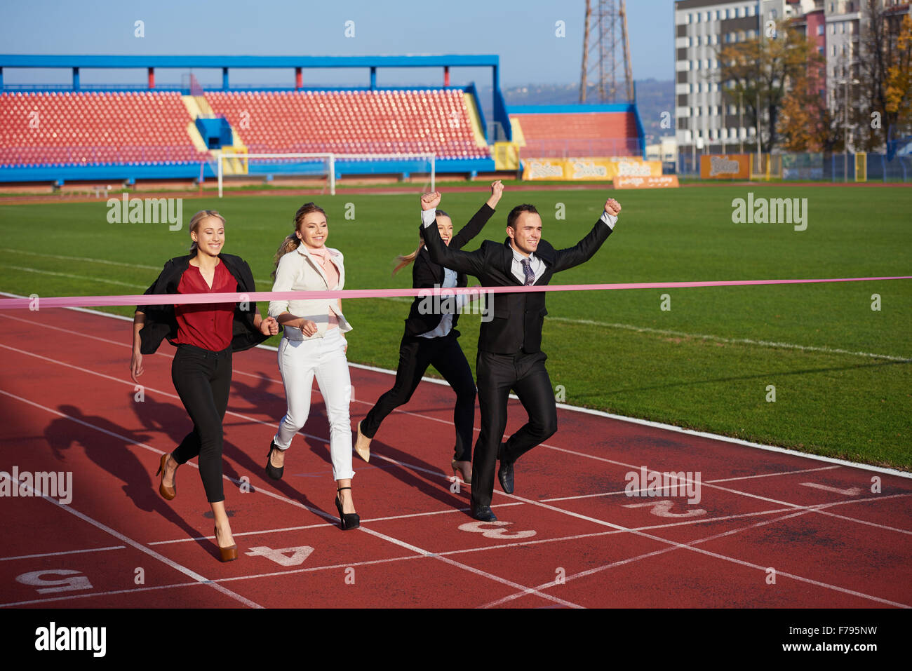 business people running together on racing track Stock Photo - Alamy