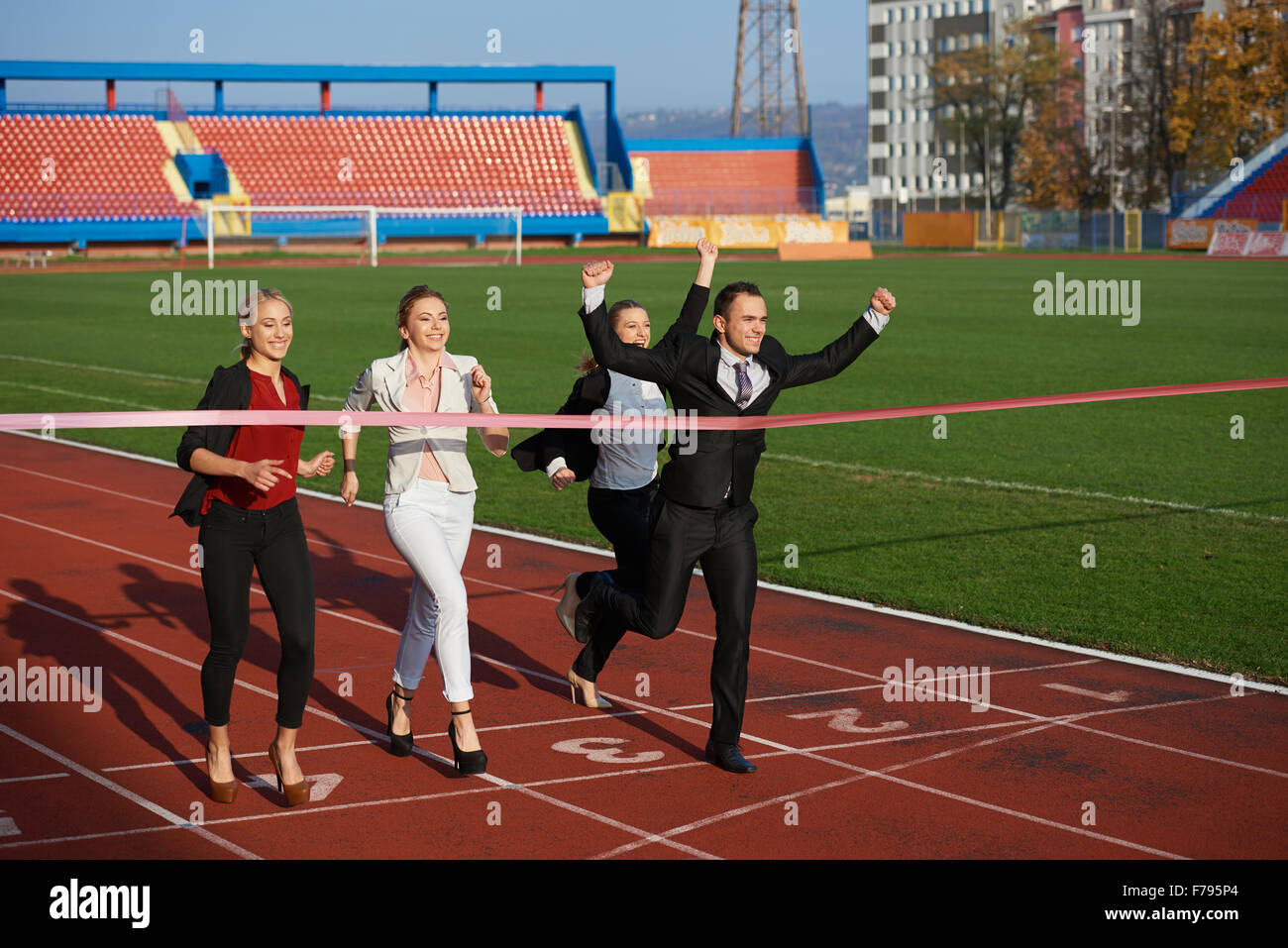 business people running together on racing track Stock Photo - Alamy
