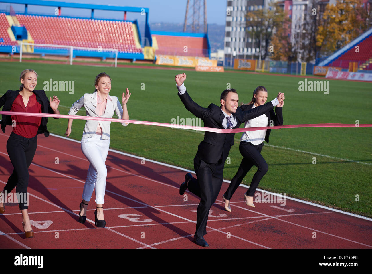 business people running together on athletics racing track Stock Photo ...