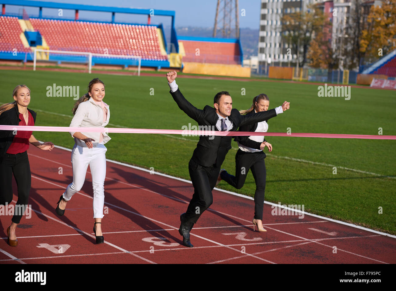 business people running together on racing track Stock Photo - Alamy