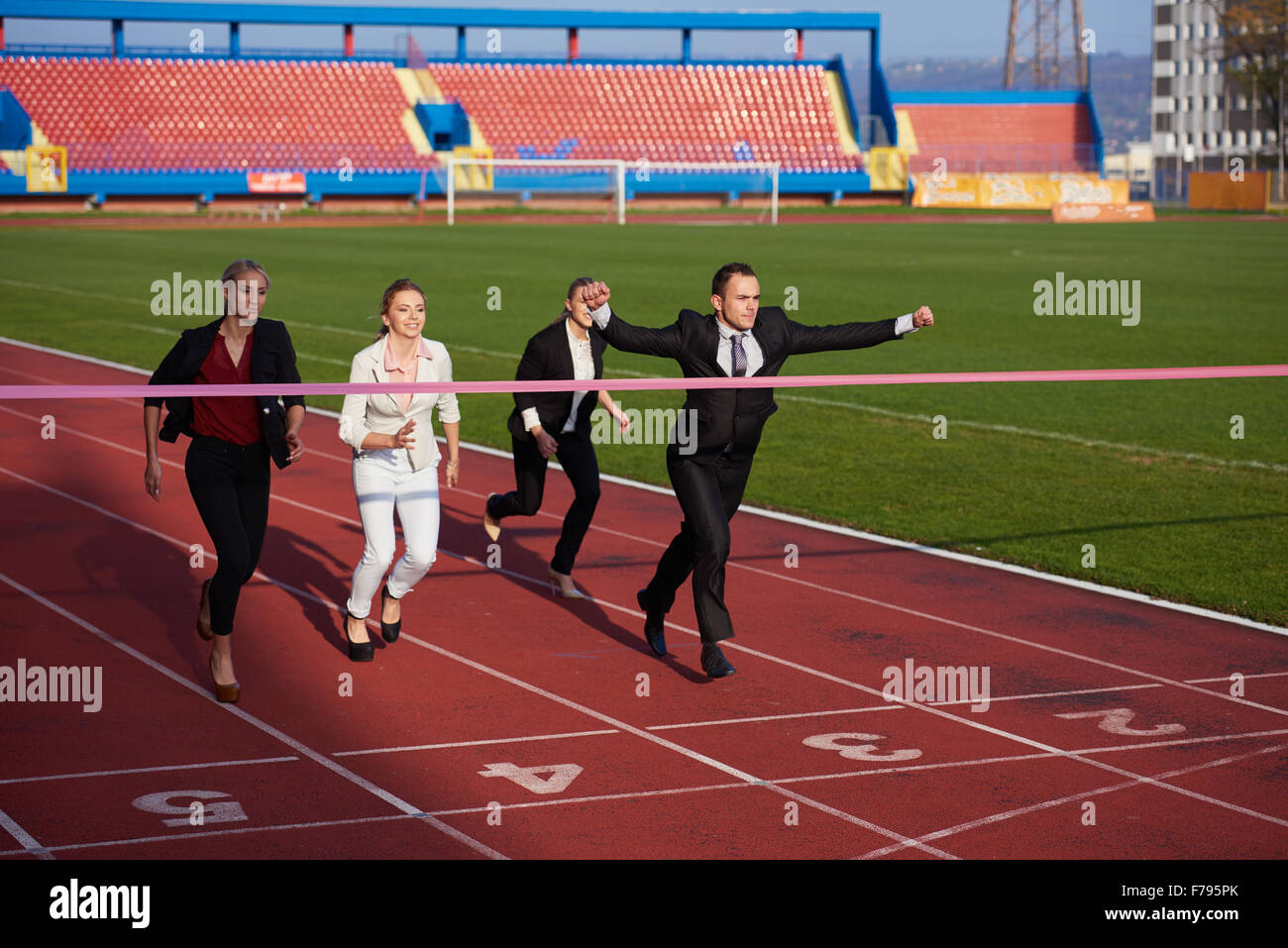 business people running together on racing track Stock Photo - Alamy