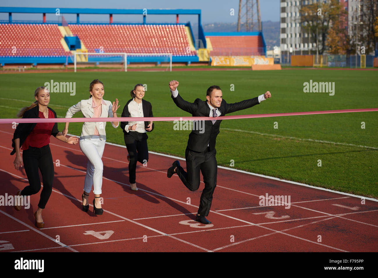 business people running together on racing track Stock Photo - Alamy