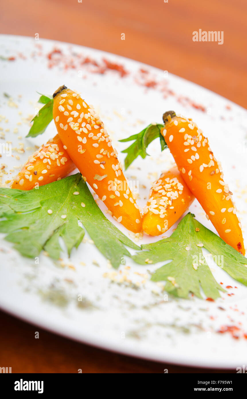 Boiled carrots served in the plate Stock Photo - Alamy