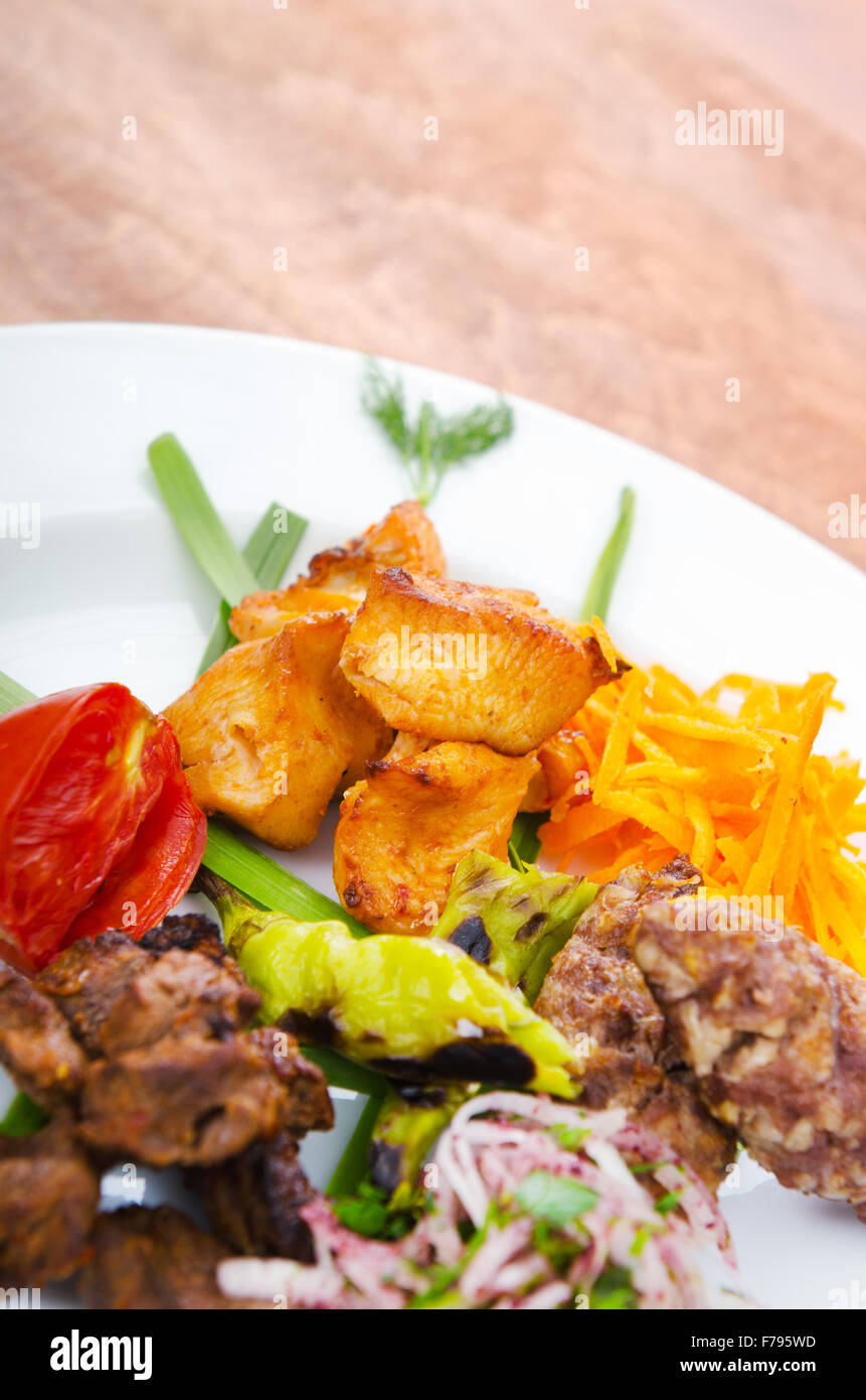 Plate with tasty lamp kebabs Stock Photo - Alamy