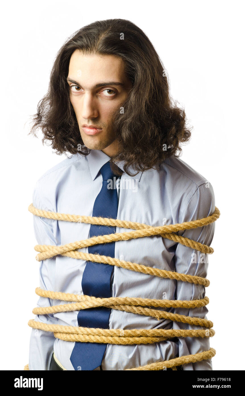 Young businessman tied with rope Stock Photo - Alamy