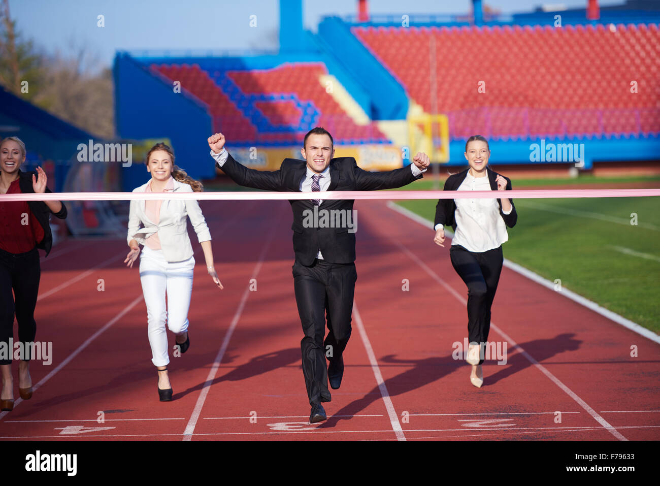 business people running together on athletics racing track Stock Photo ...