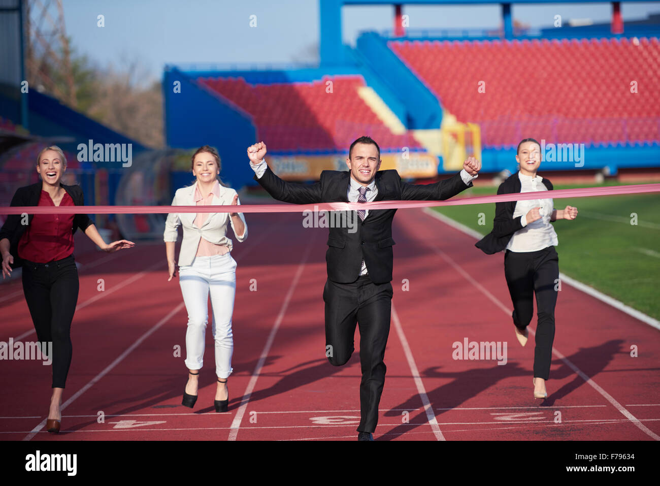 business people running together on racing track Stock Photo - Alamy
