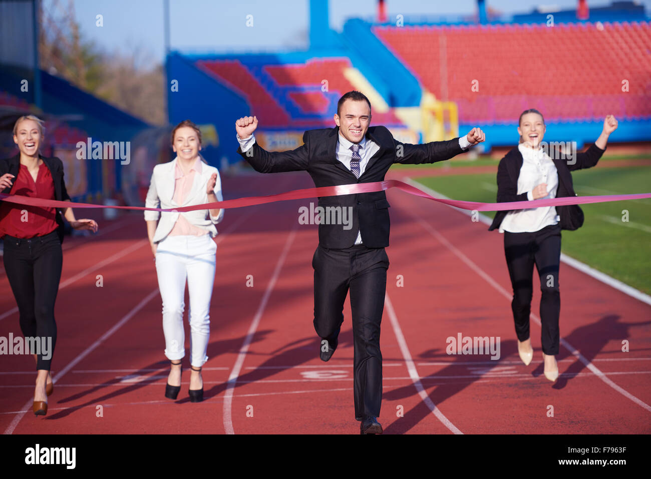 business people running together on athletics racing track Stock Photo ...