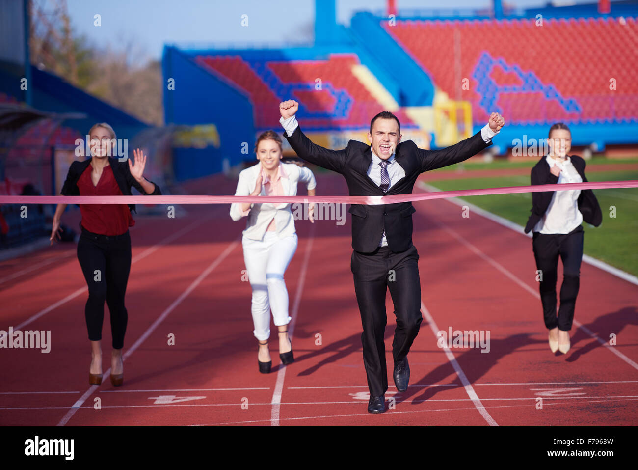 business people running together on athletics racing track Stock Photo ...