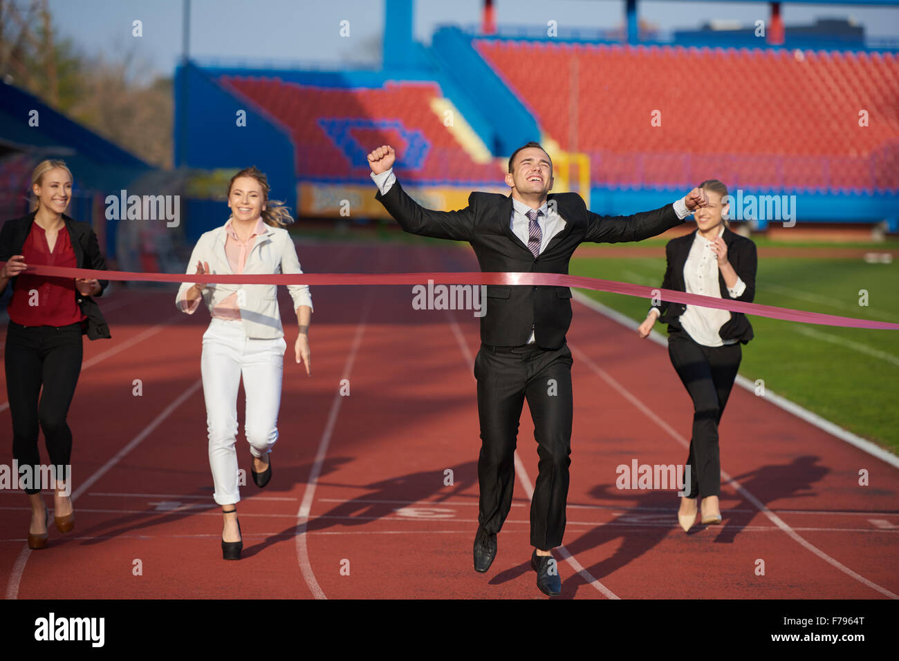 business people running together on racing track Stock Photo - Alamy
