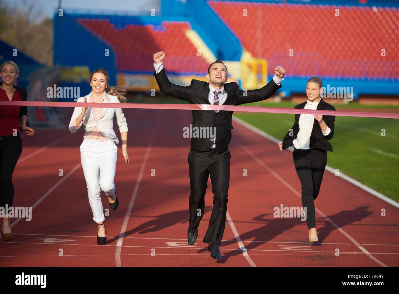 business people running together on racing track Stock Photo - Alamy