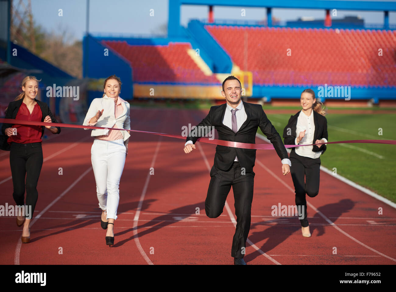 business people running together on racing track Stock Photo - Alamy