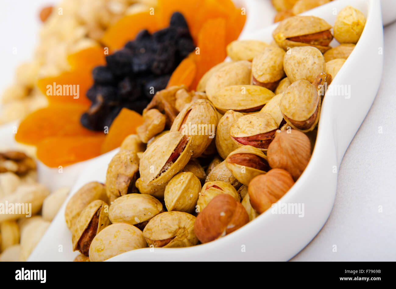Nut selection served in the plate Stock Photo - Alamy