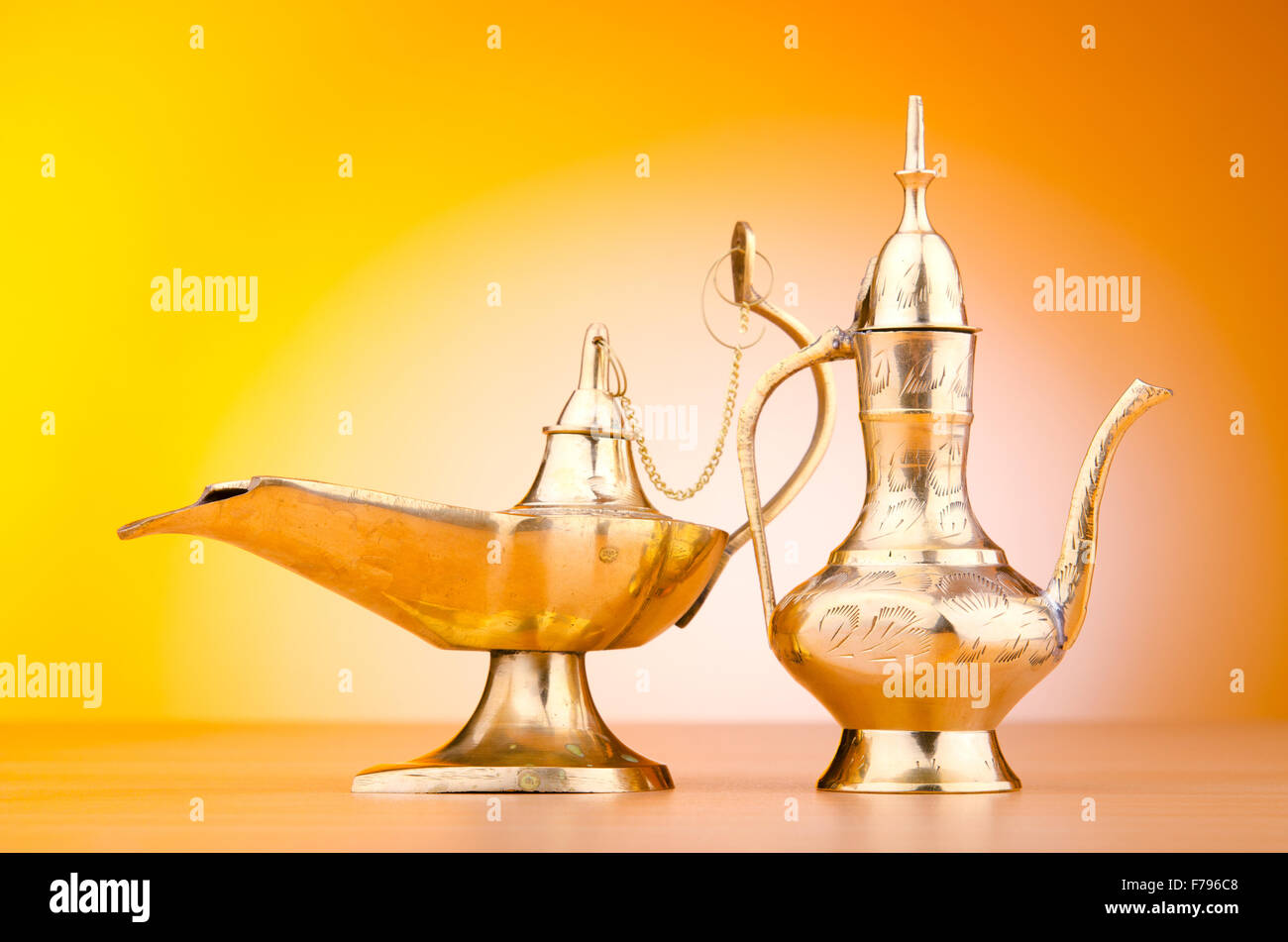 Ancient lamp against gradient background Stock Photo - Alamy