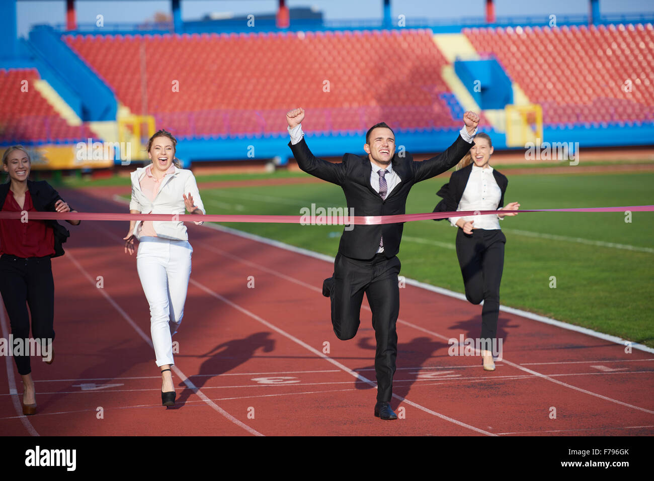 business people running together on athletics racing track Stock Photo ...