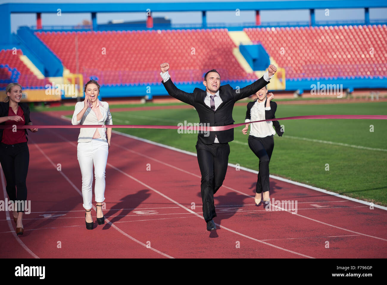 business people running together on racing track Stock Photo - Alamy